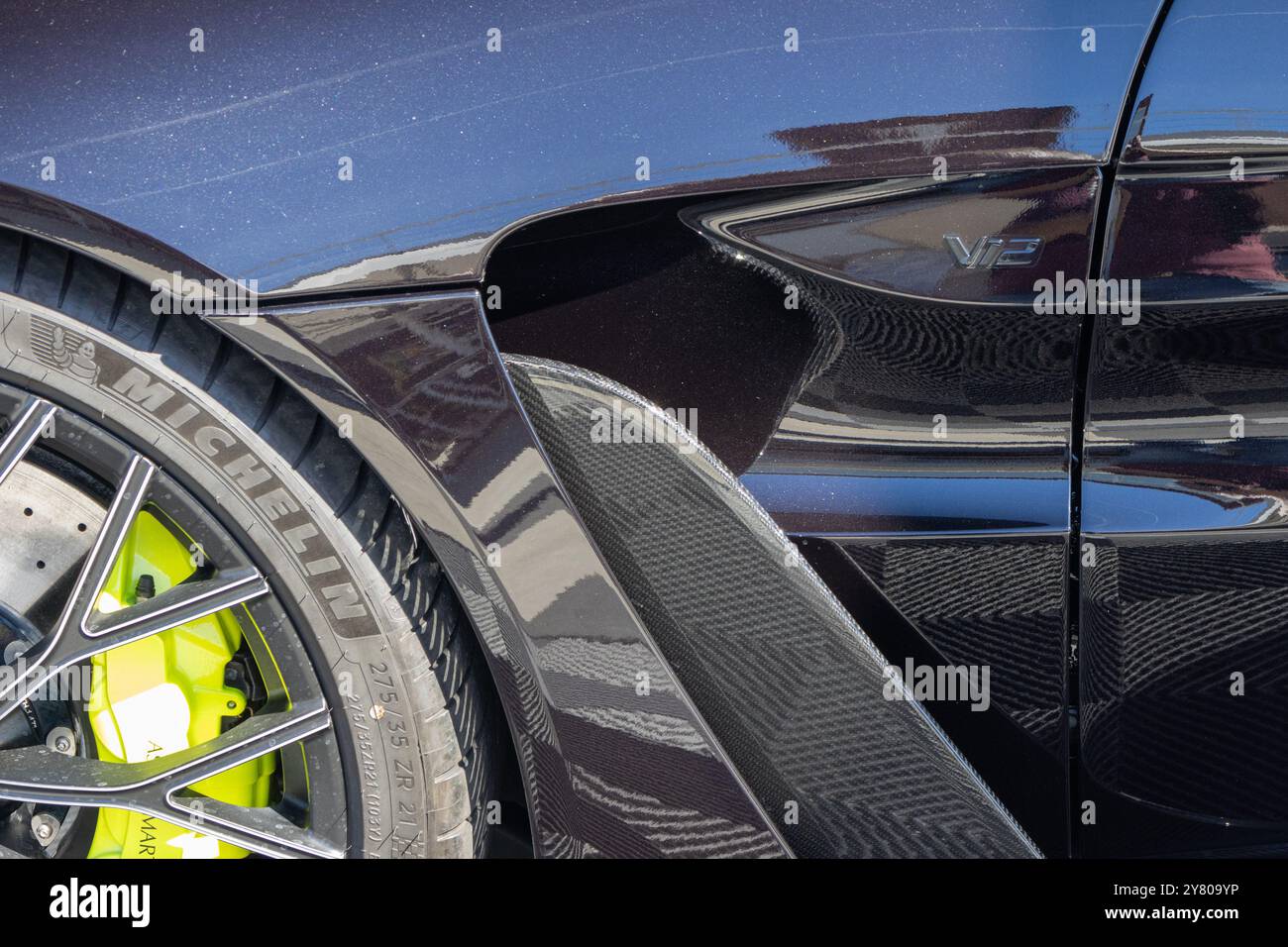Close up view of an aston martin vantage showing the front wheel ...
