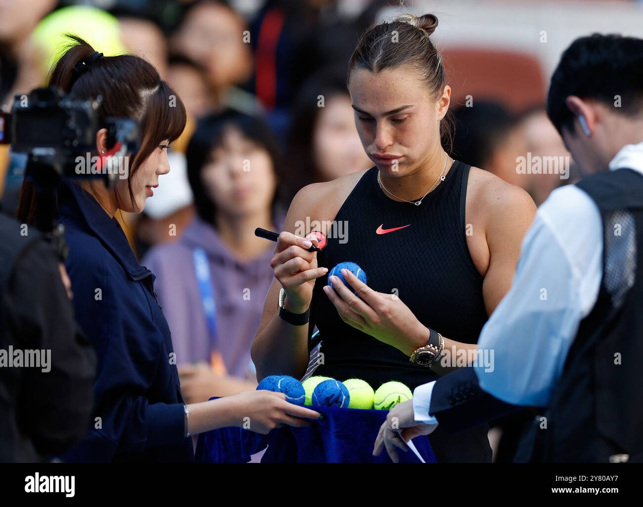 Beijing, China. 2nd Oct, 2024. Aryna Sabalenka of Belarus signs ...