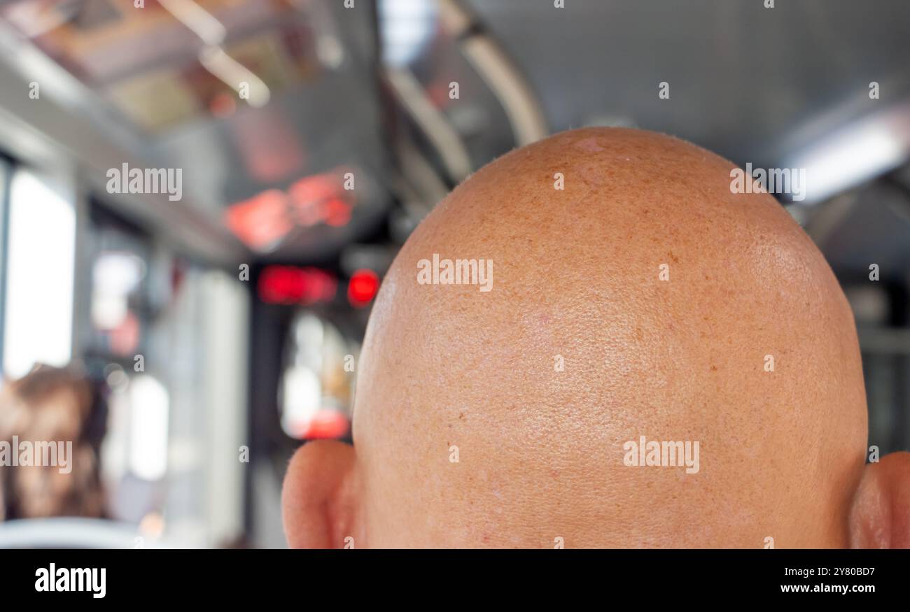Head of a bald passenger in a city bus Stock Photo - Alamy