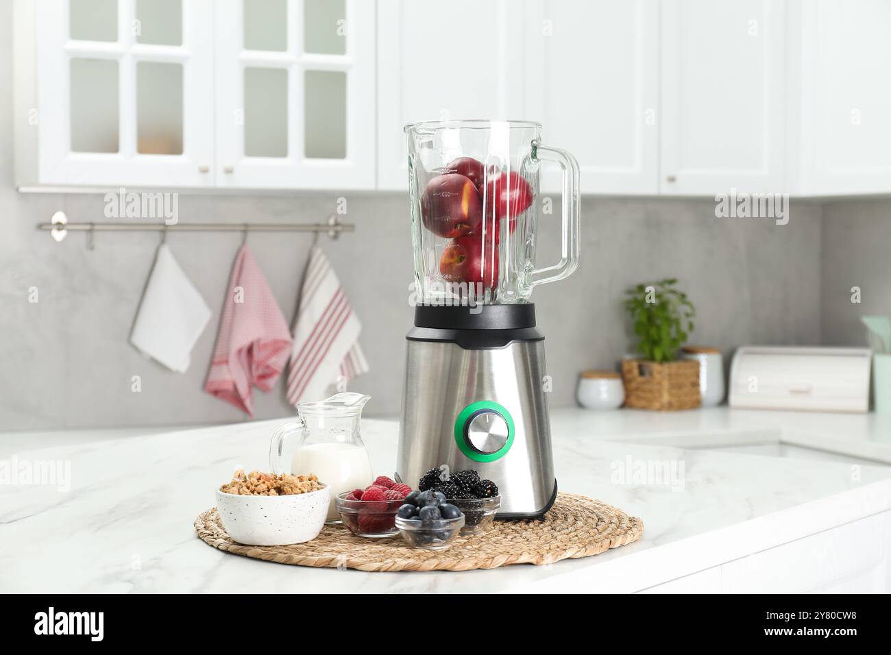 Blender and fresh ingredients on white marble table in kitchen Stock ...