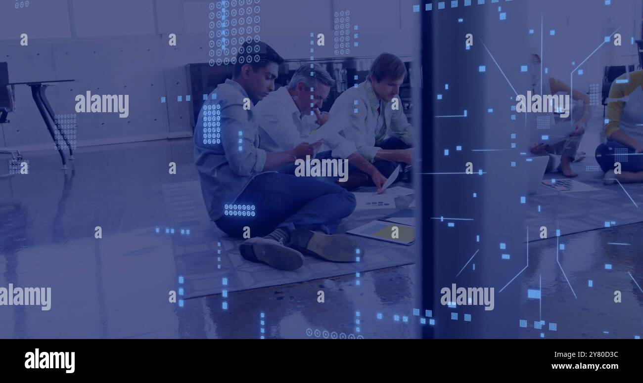 Analyzing documents, group of people sitting on floor with data ...