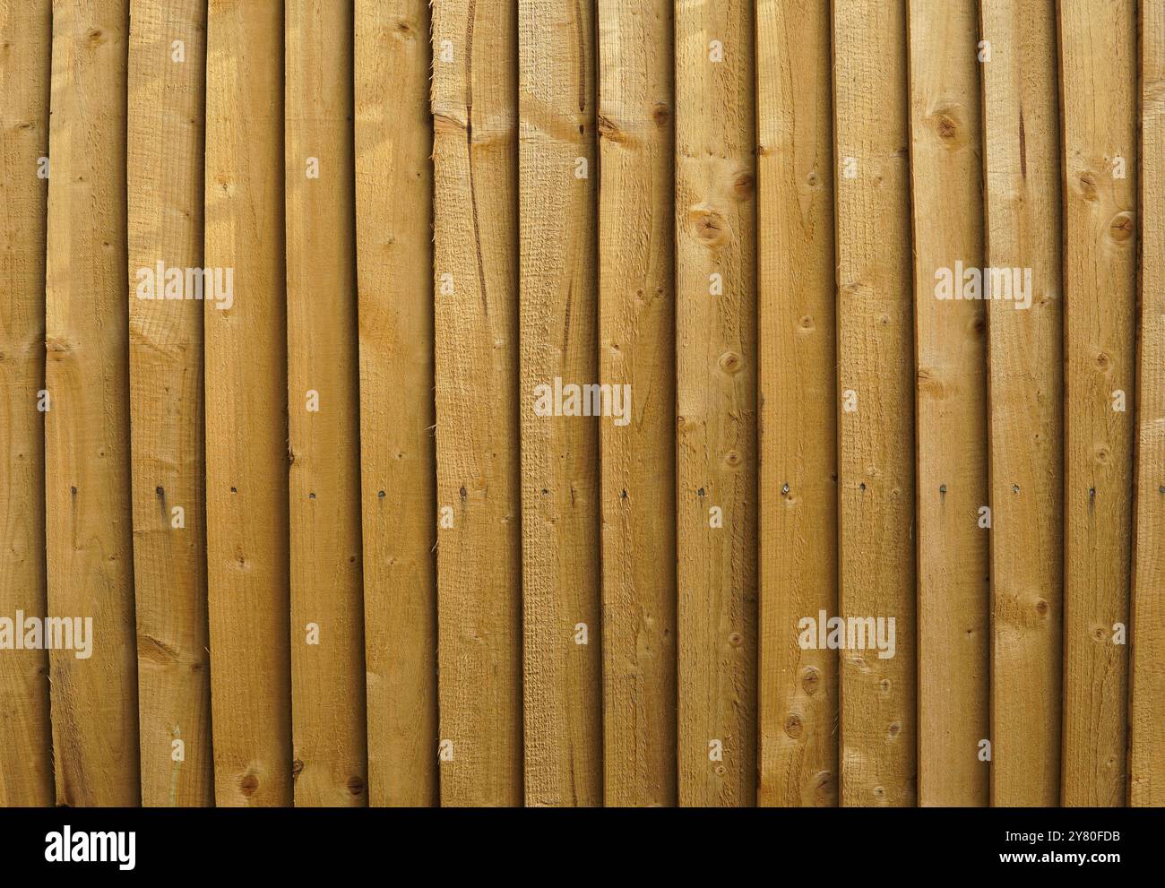 Vertical wooden brown fence texture for backgrounds. It was taken in a ...