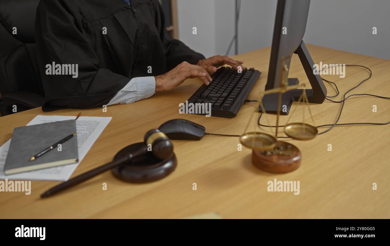 Man typing on a keyboard in a courtroom office, surrounded by judge's ...