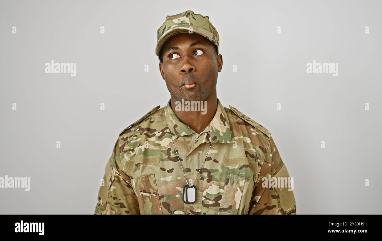 African american military man in camouflage attire with dog tags ...