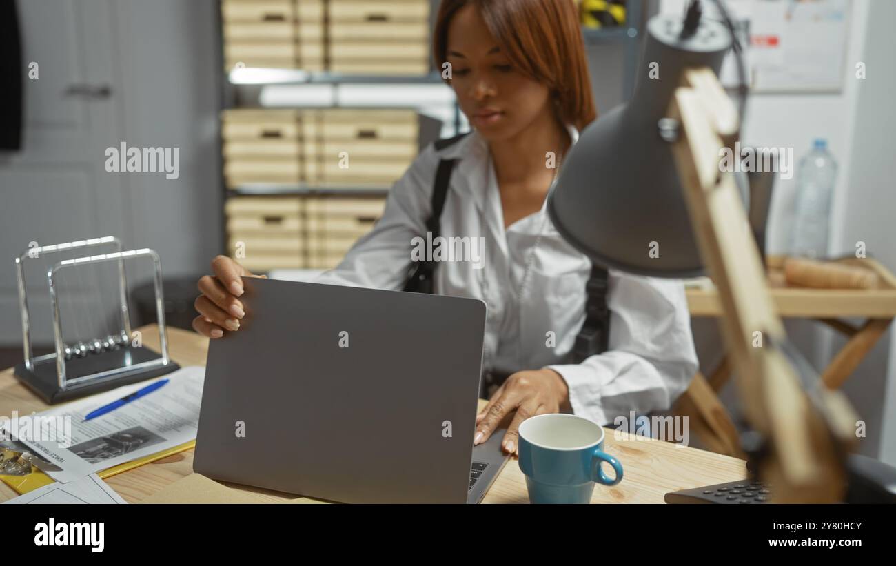 African american woman detective working indoors at police department ...