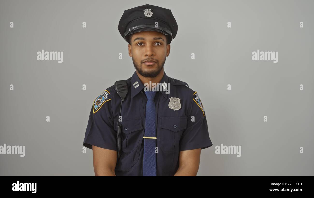 Portrait of an authoritative african american police officer isolated ...