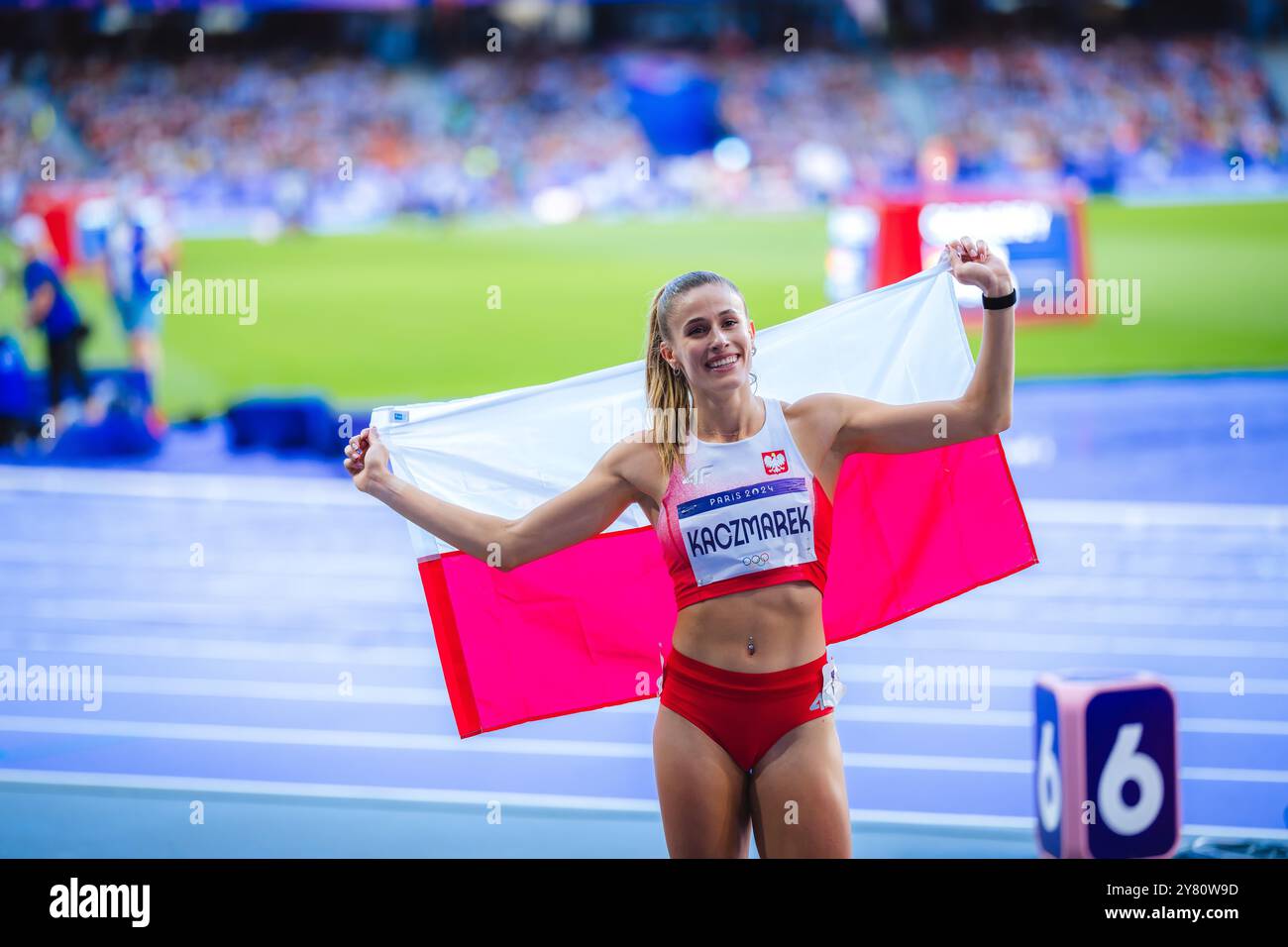 Natalia BUKOWIECKA Kaczmarek celebrating with her country's flag in the ...