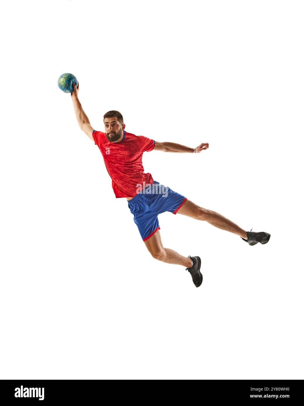 Full-length dynamic image of competitive young man, handball player in ...
