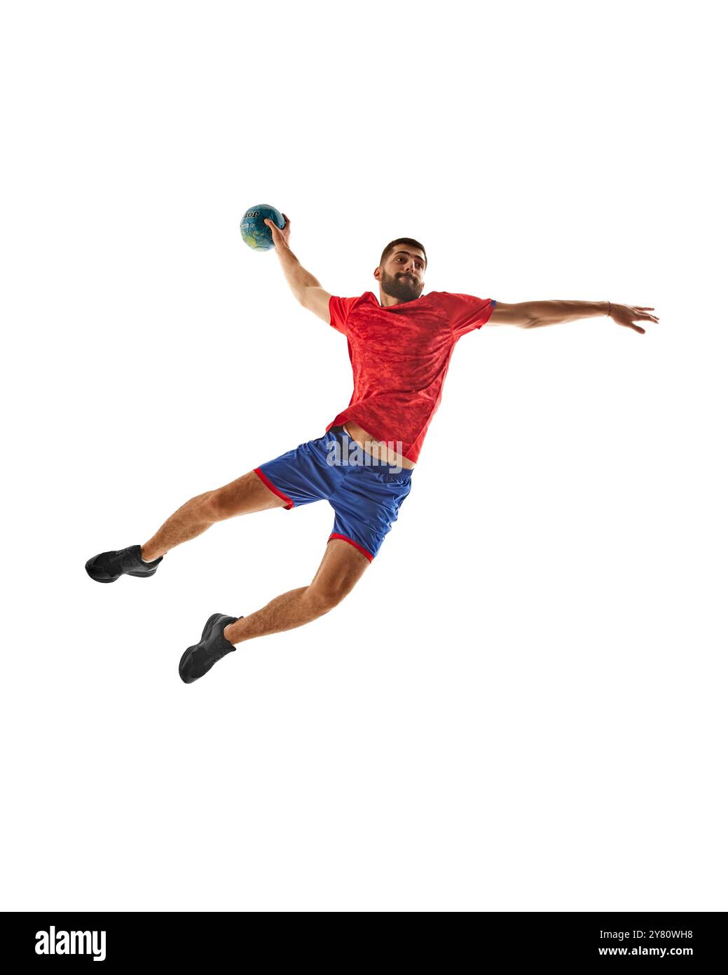 Full-length dynamic image of competitive young man, handball player in ...