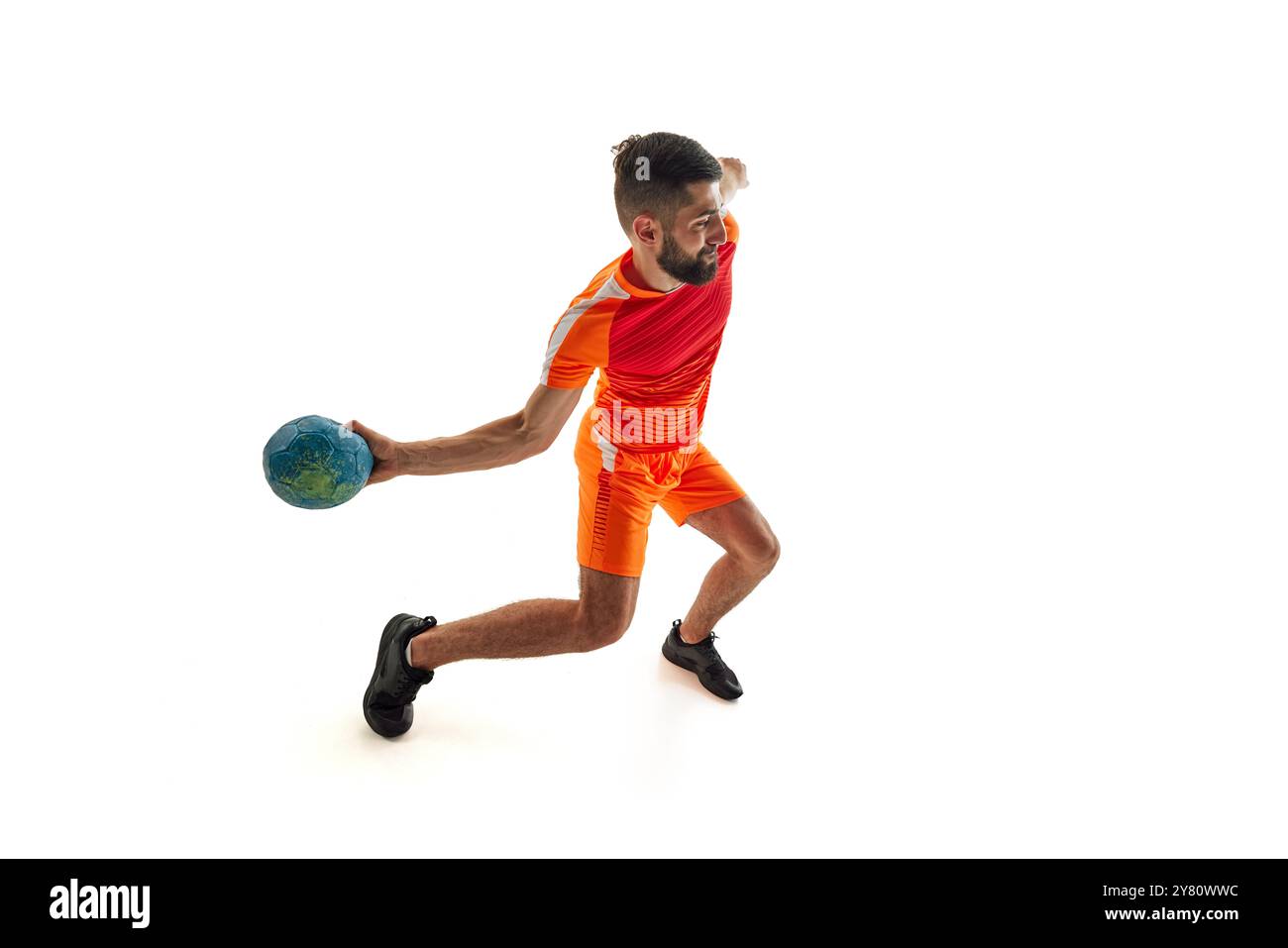 Scoring winning goals. Competitive young man, handball player in motion ...