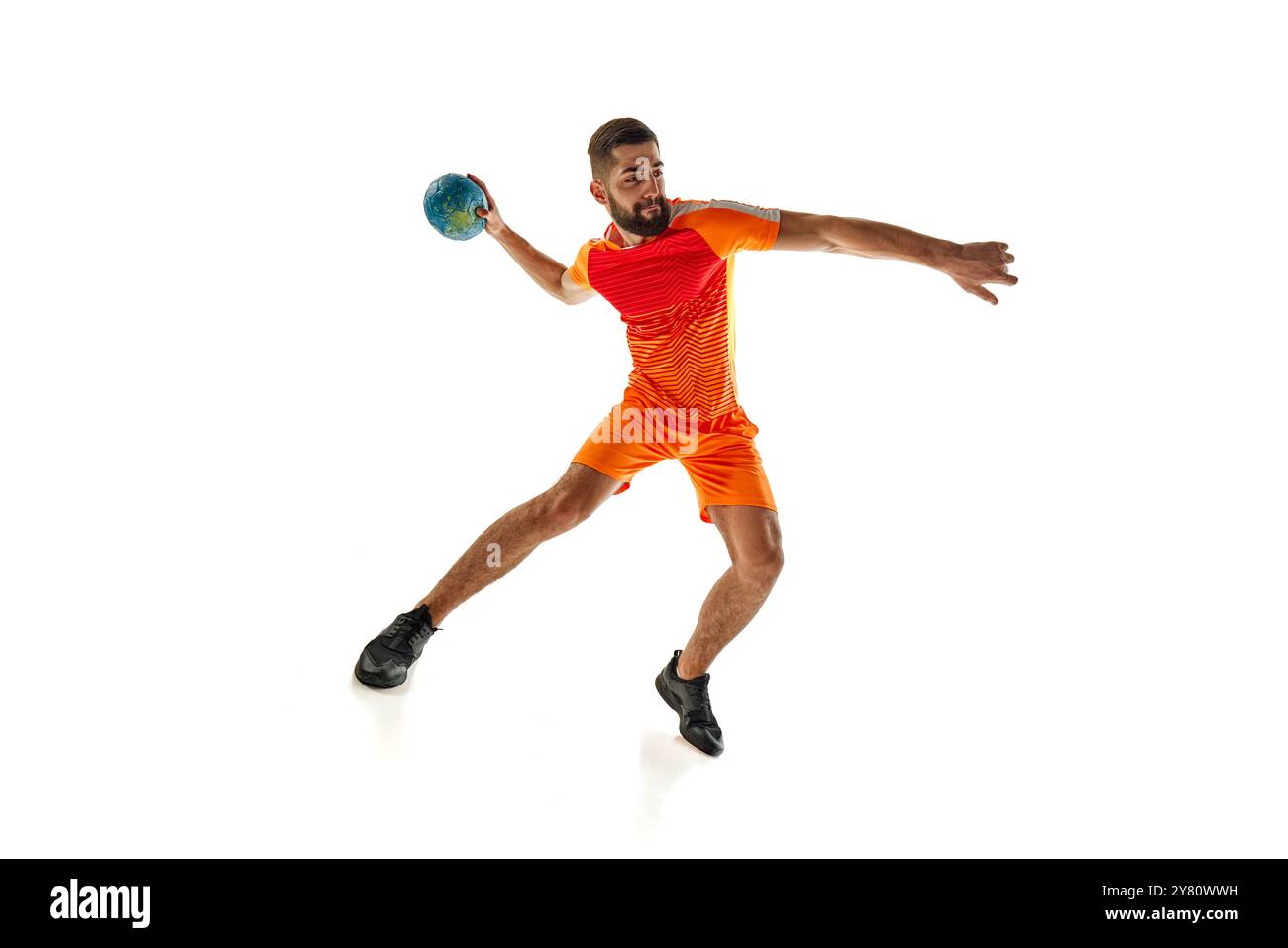 Scoring winning goals. Competitive young man, handball player in motion ...