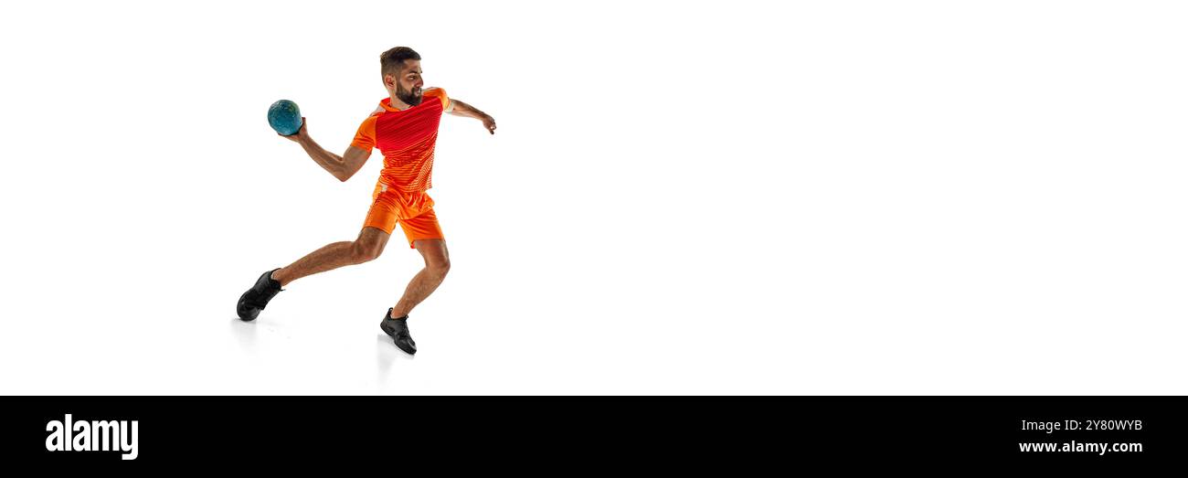 Competitive young man, handball player in motion during intense game ...