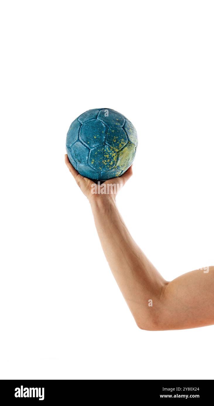 Vertical image. Male muscular hand holding handball ball isolated on ...