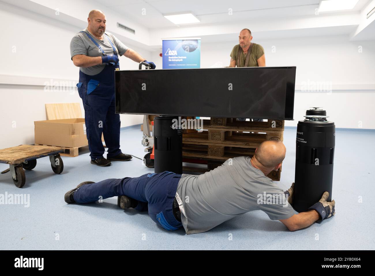 02 October 2024, Saxony, Görlitz: Employees of a transport company ...