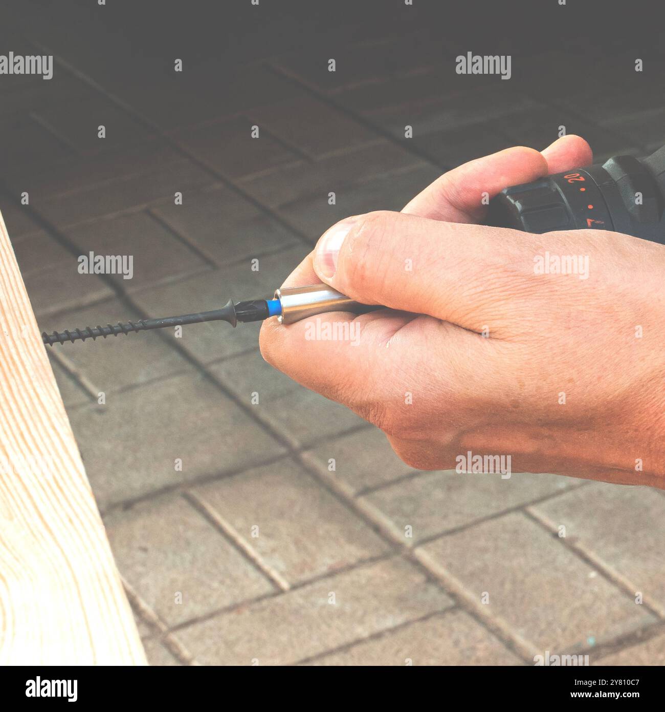 Work with electric tools. Screwdriver in the hands of a man Stock Photo ...