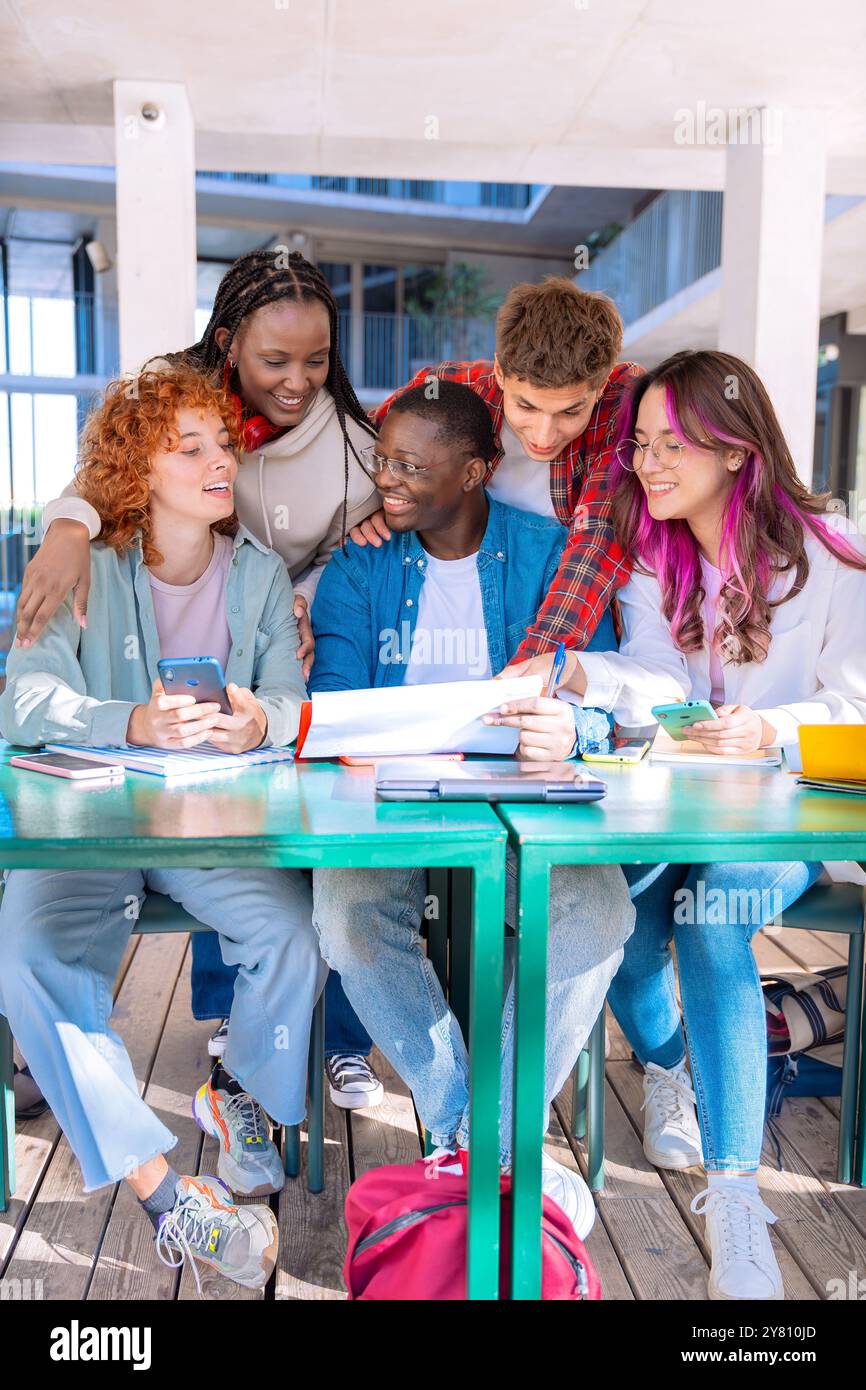 Happy diverse group of students studying in the library.Vertical Stock ...