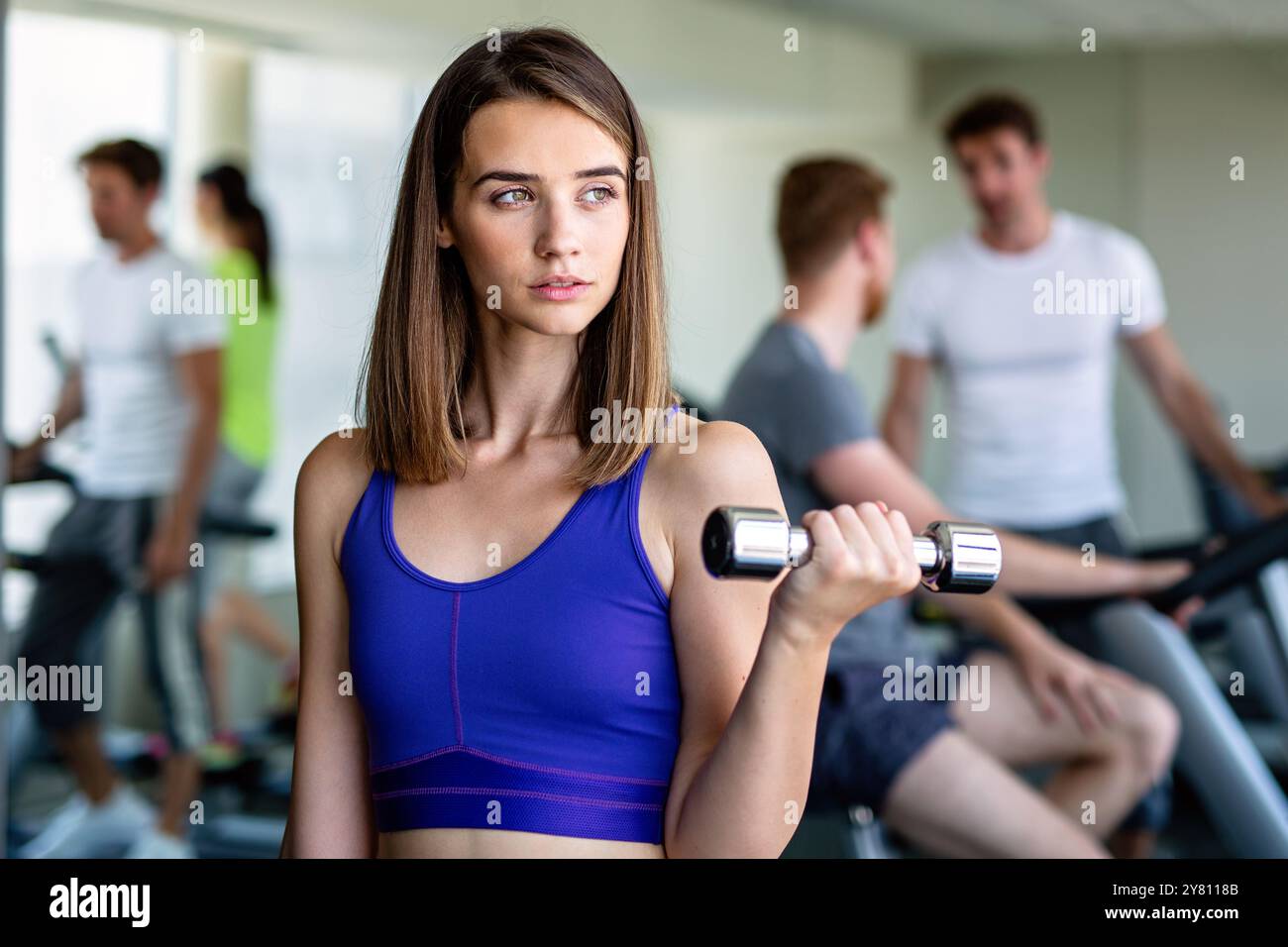 Fitness woman. Fit fitness girl smiling happy lifting weights looking ...