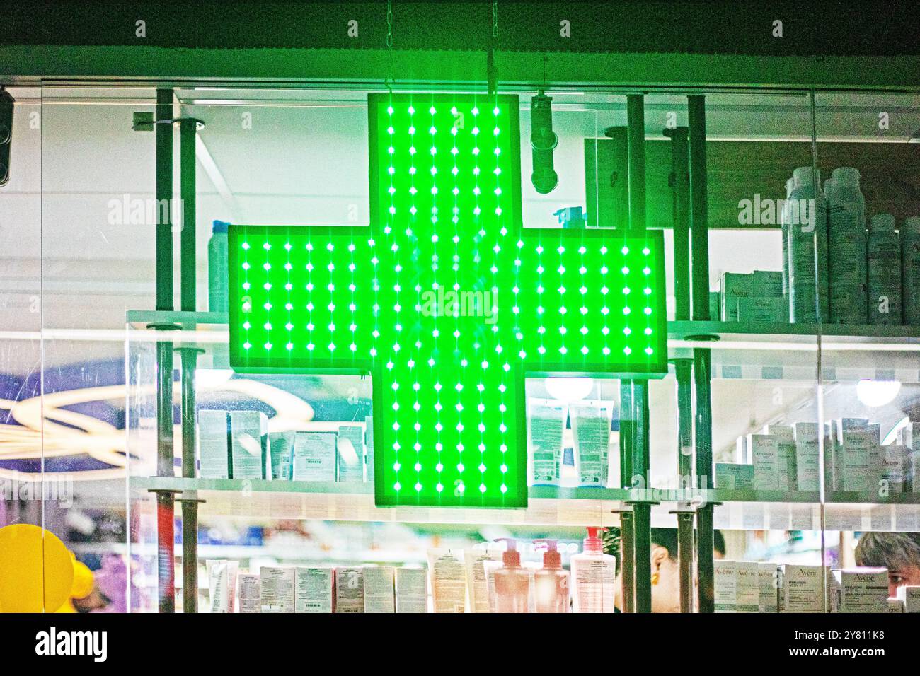 green cross of health of a pharmacy in an interior Stock Photo - Alamy