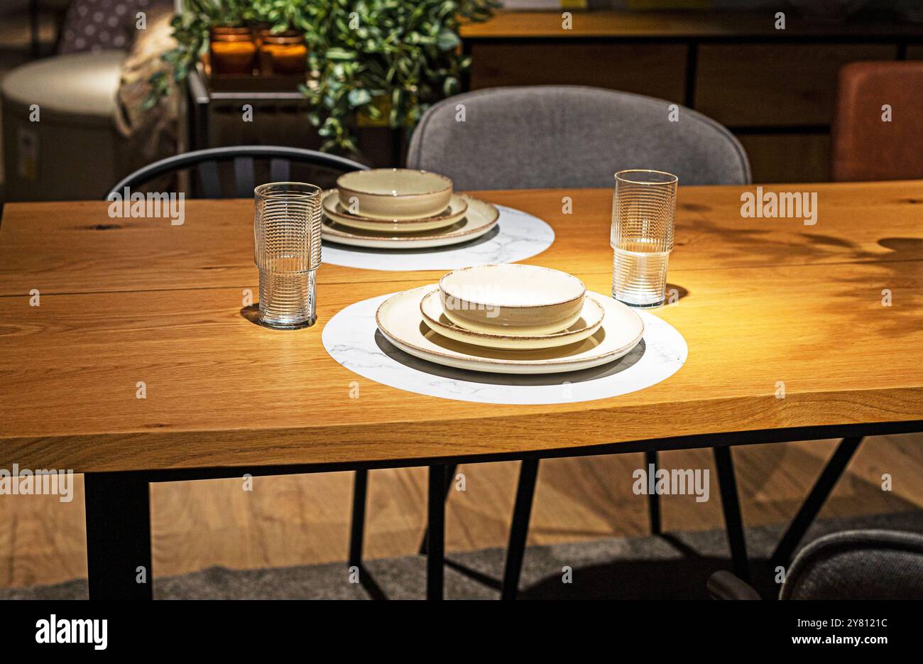 stylish tableware on the table in a modern interior Stock Photo - Alamy