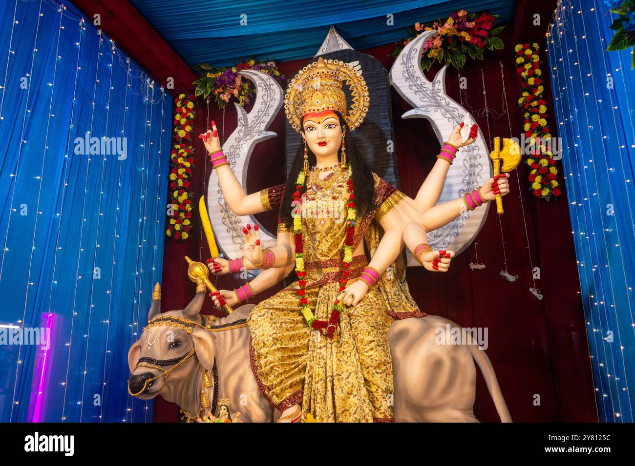 A beautiful idol of Maa Durga being worshipped at a pandal during ...