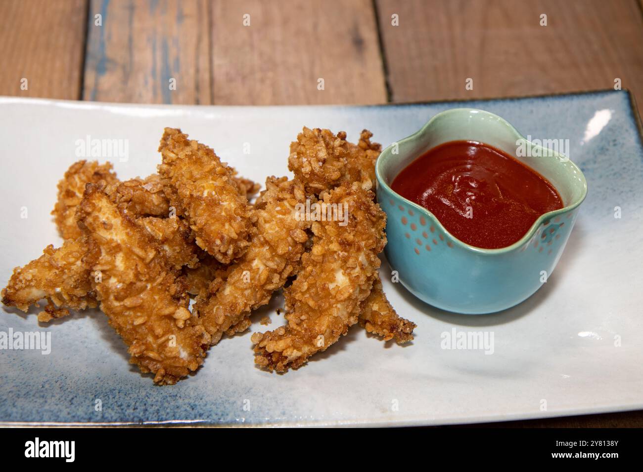 A plate of crispy chicken strips made from Rice Krispies Multigrain ...