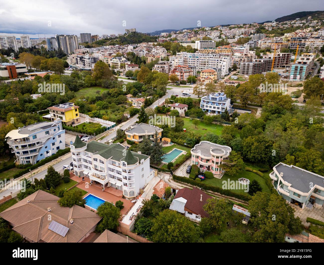 Aerial view of a suburban area with modern apartment buildings, green ...