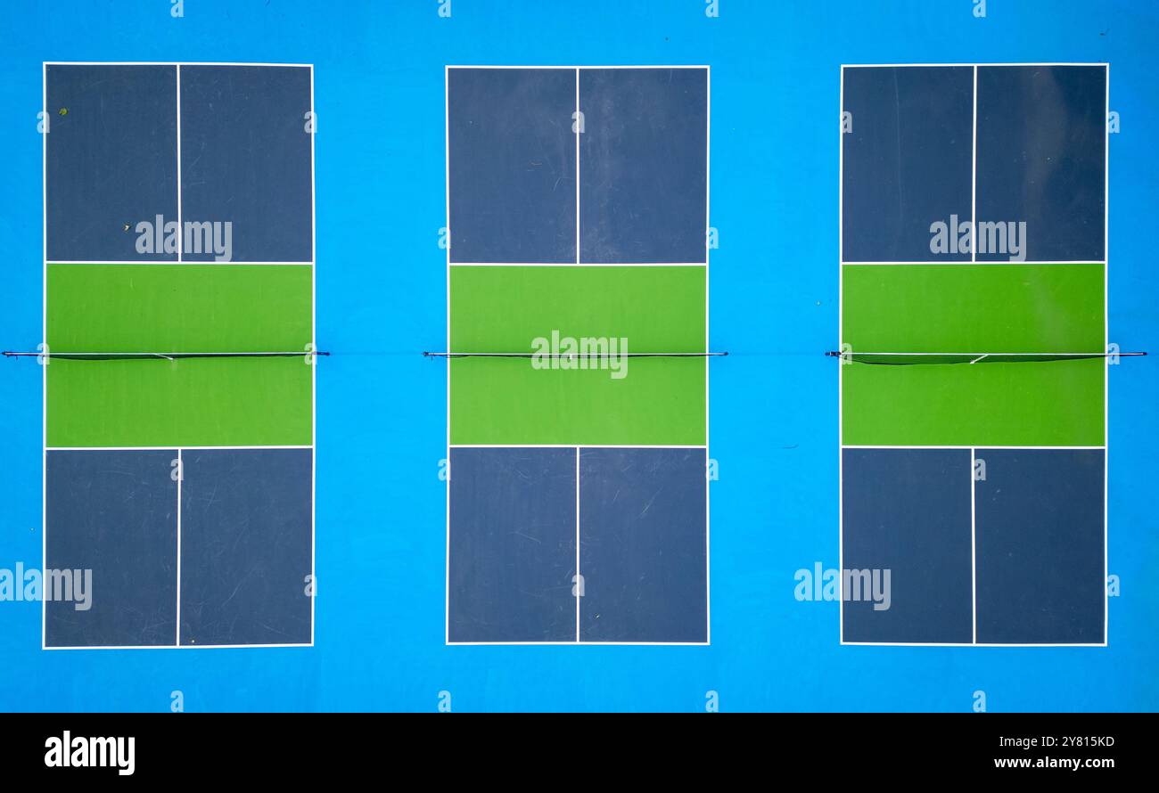 Aerial view of vibrant pickleball courts with distinct green and blue ...