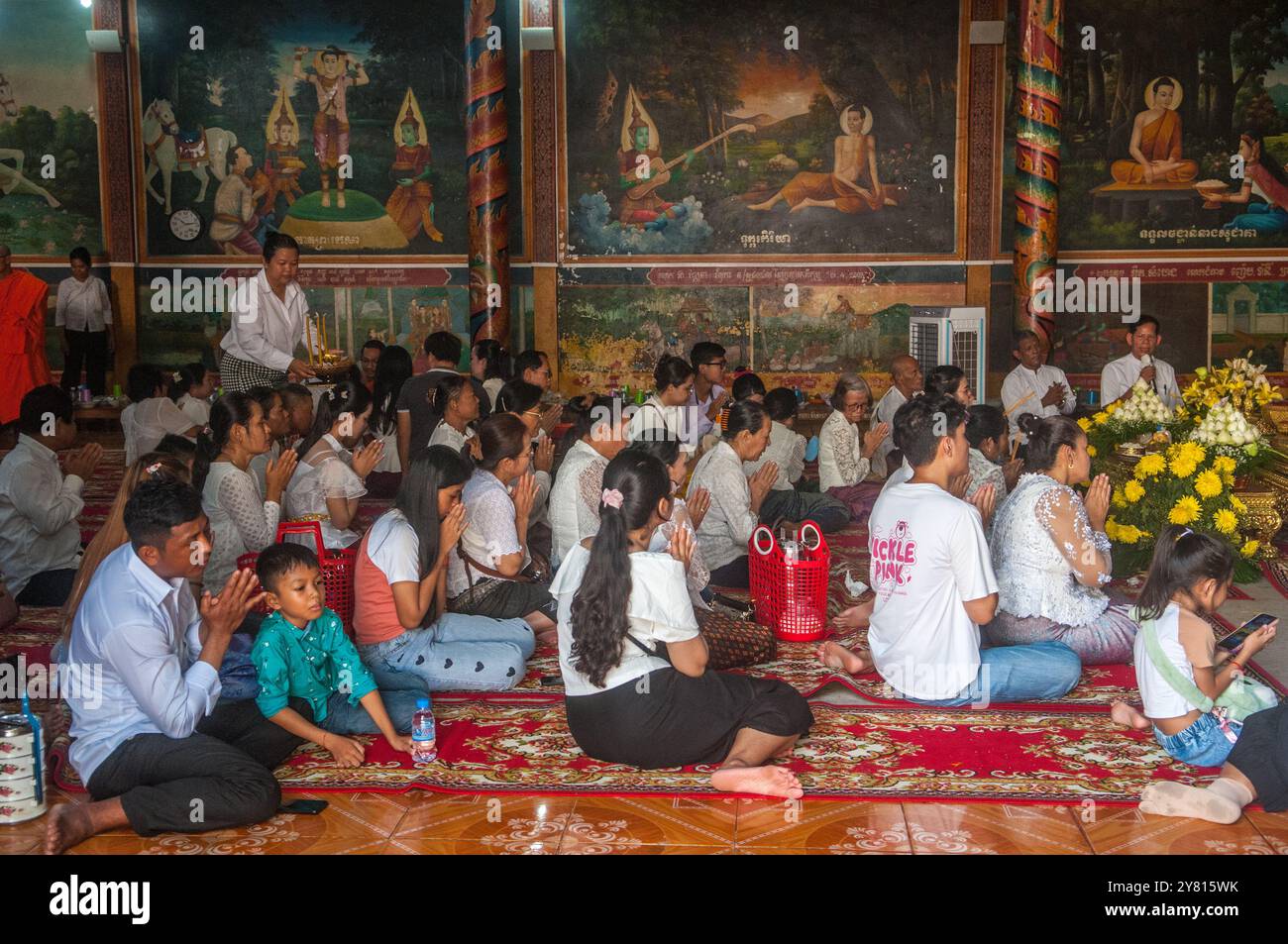Cambodian Buddhists praying at Wat Saravan temple during the Pchum Ben festival. Phnom Penh ...