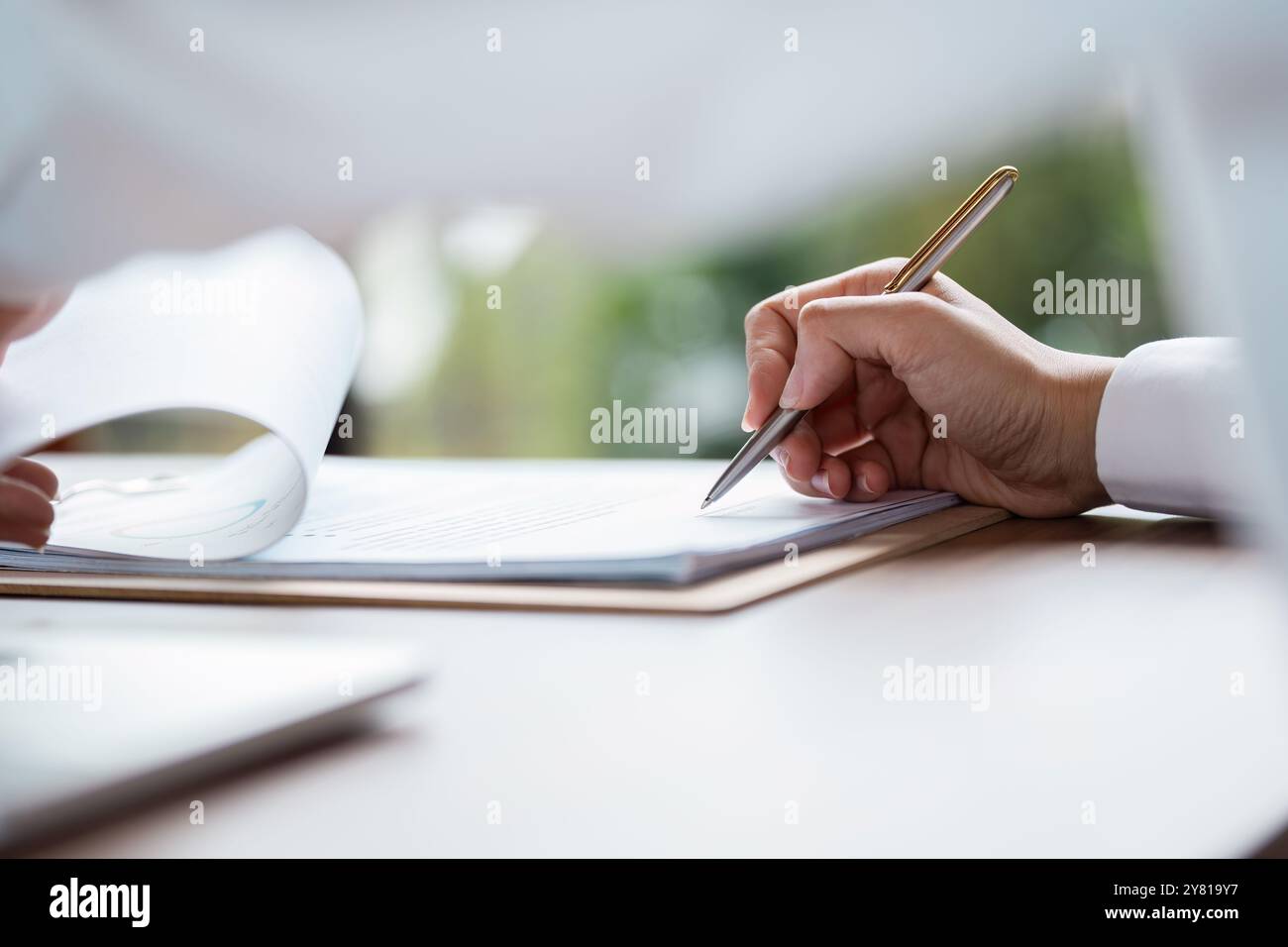 Business Agreement Signing - Close-up of Hand Signing Contract with Pen ...