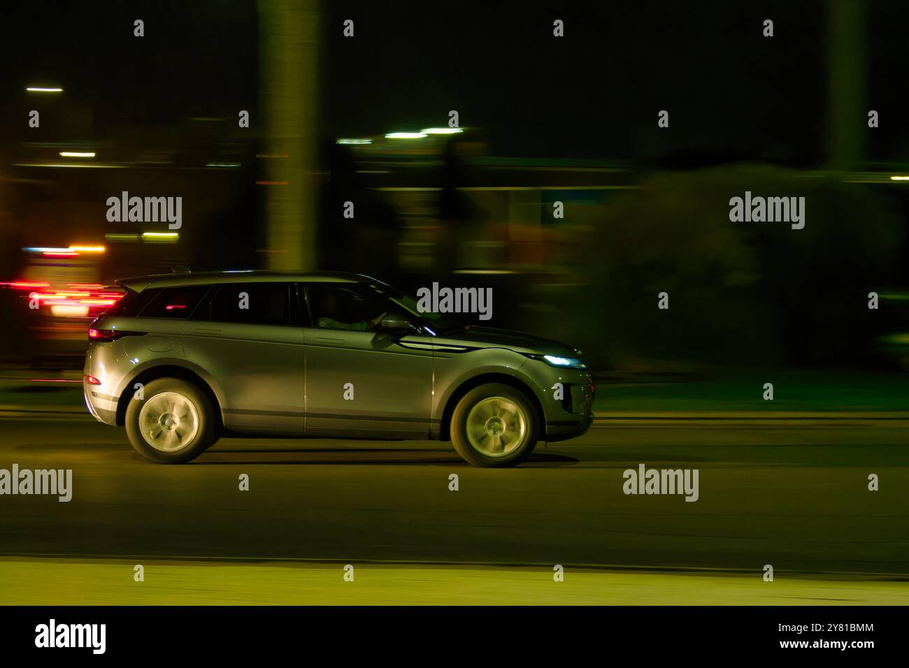 a passenger car at night with a blurred background made using the ...