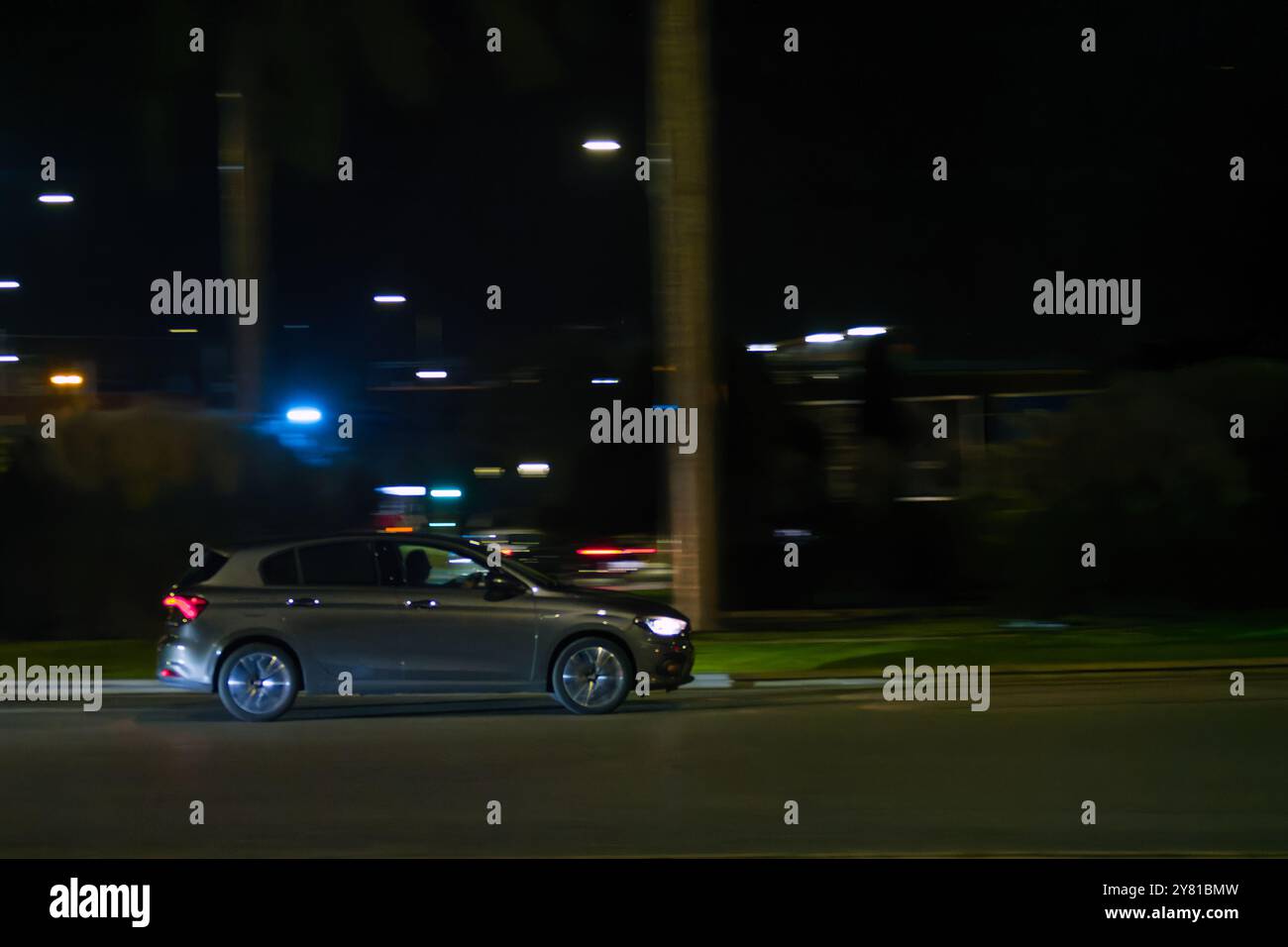 a passenger car at night with a blurred background made using the ...