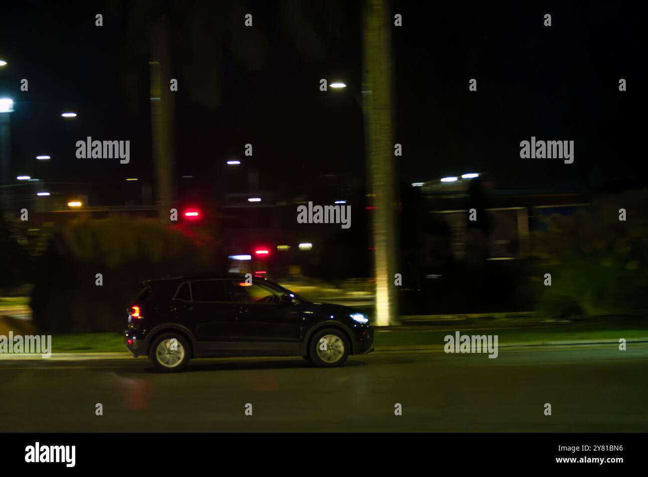 a passenger car at night with a blurred background made using the ...