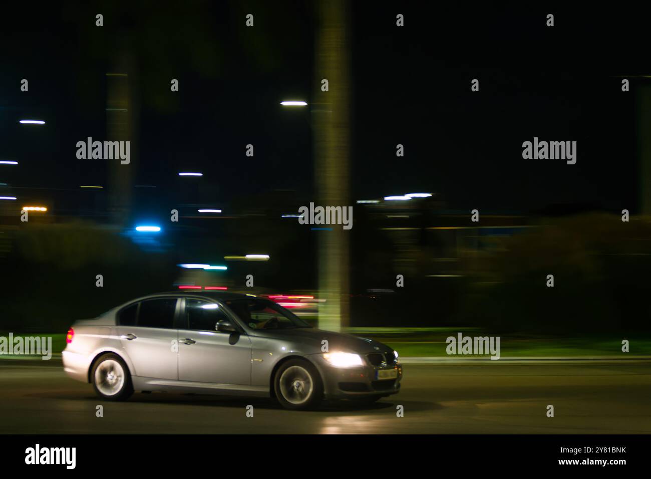 a passenger car at night with a blurred background made using the ...