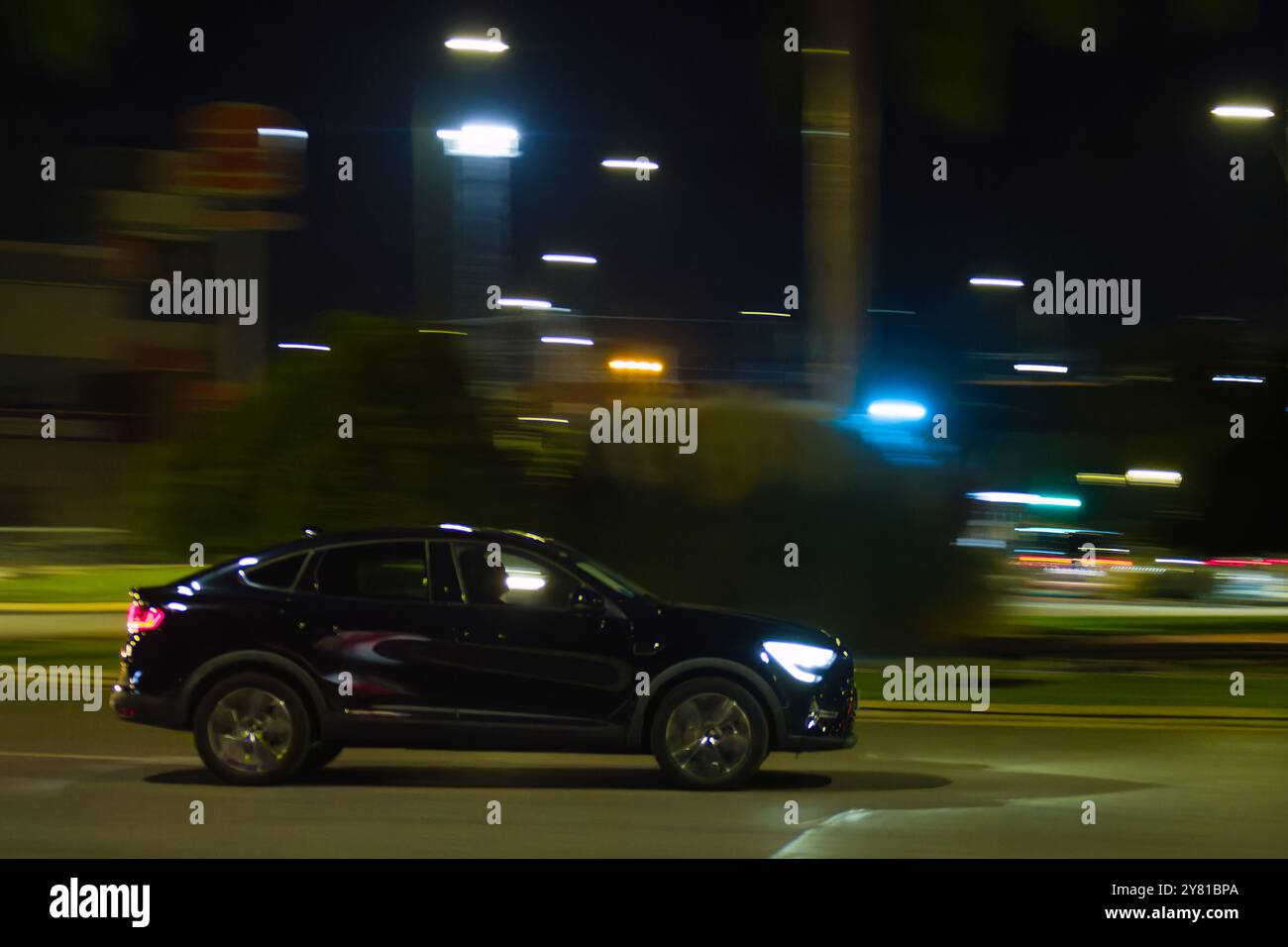 a passenger car at night with a blurred background made using the ...