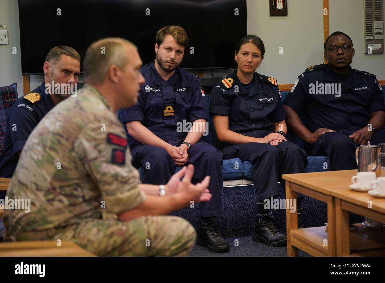 Brigadier Maynard, CJFO (Commander Joint Force Operations) (left) gives ...