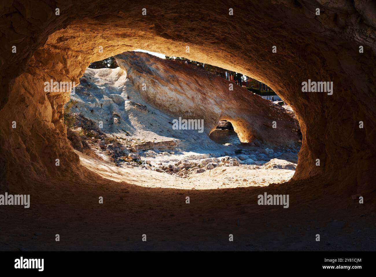 A scenic view through the natural opening of a cave Stock Photo - Alamy