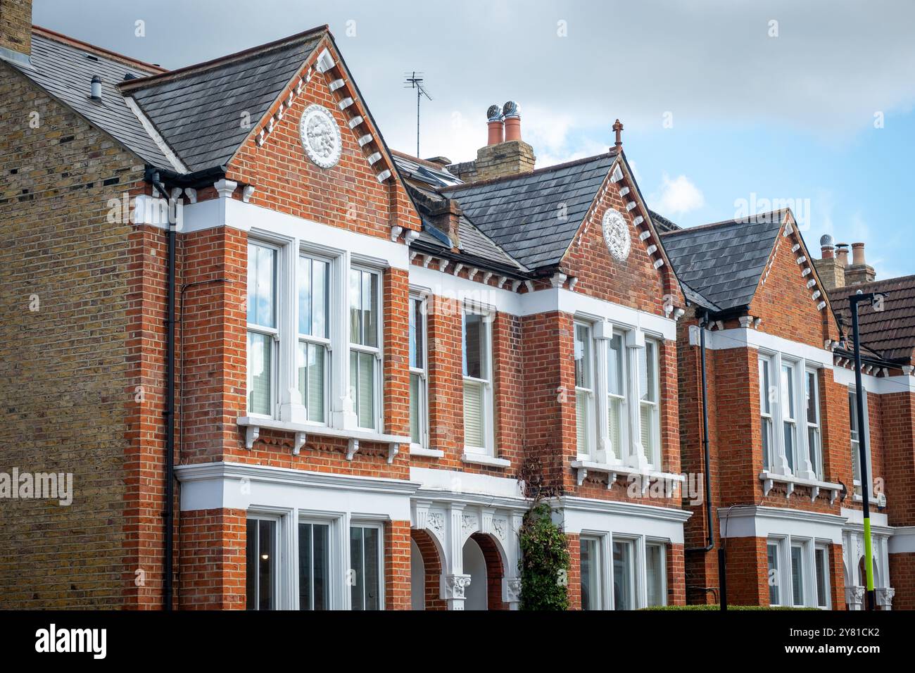 Street of typical British brick terraced houses in suburban London- UK ...