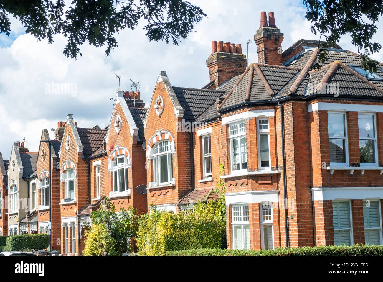 Street of typical British brick terraced houses in suburban London- UK ...