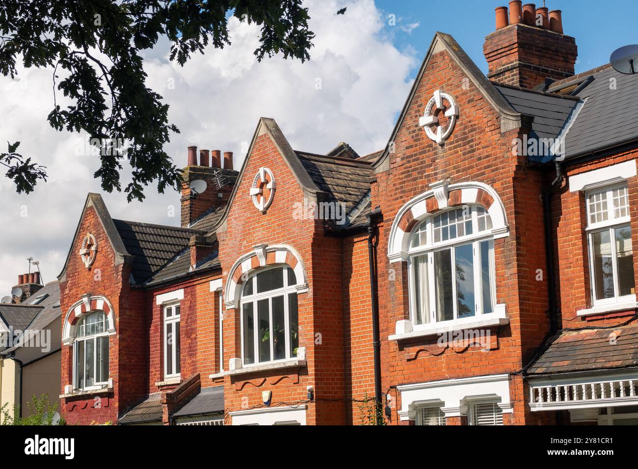 Street of typical British brick terraced houses in suburban London- UK ...