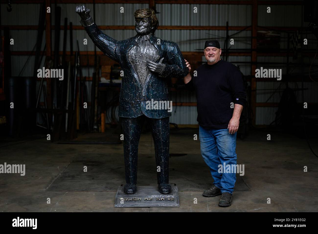 Artist Bill Secunda posses for a photograph with his sculpture of ...