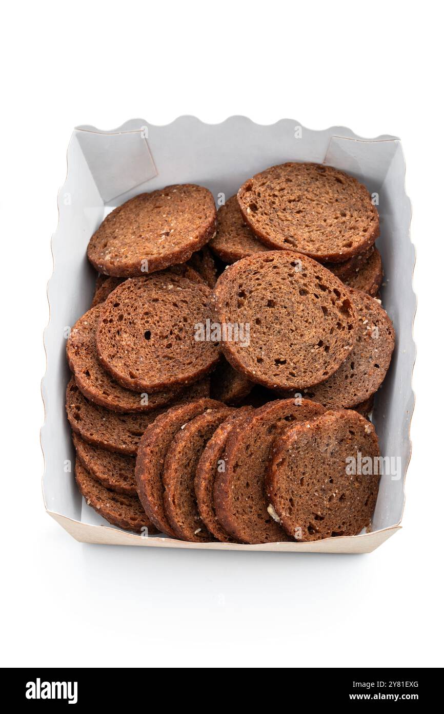 Rye bread crackers in paper bowl isolated on white background Stock ...