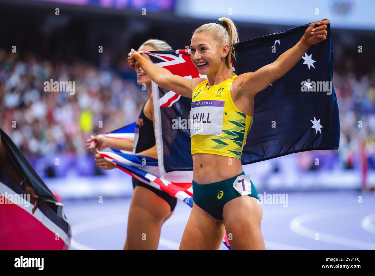 Jessica Hull celebrating with her country's flag in the 1500 meters at ...