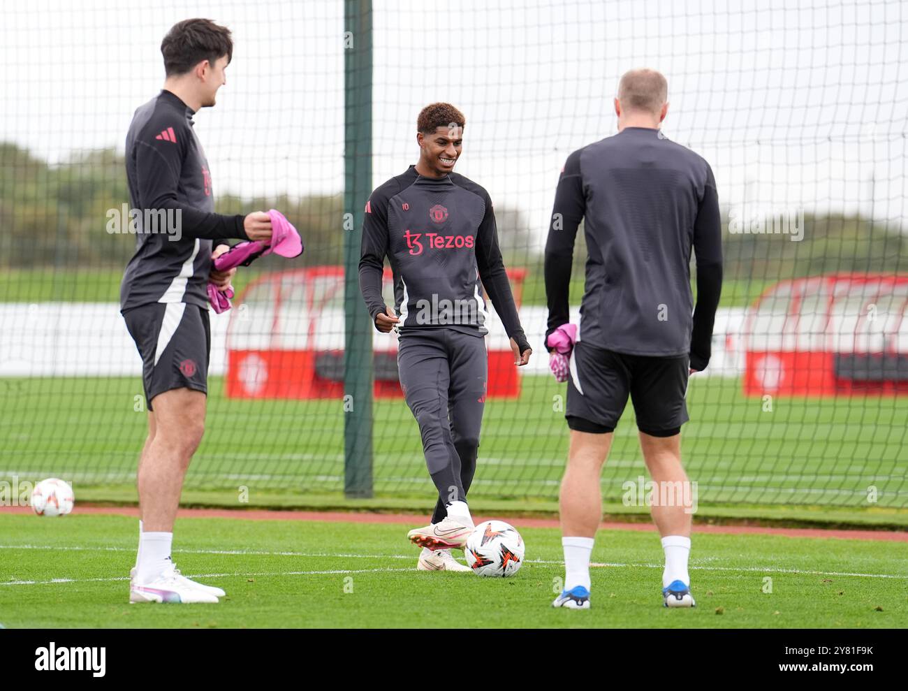 Manchester United's Marcus Rashford (centre), Harry Maguire (left) and ...