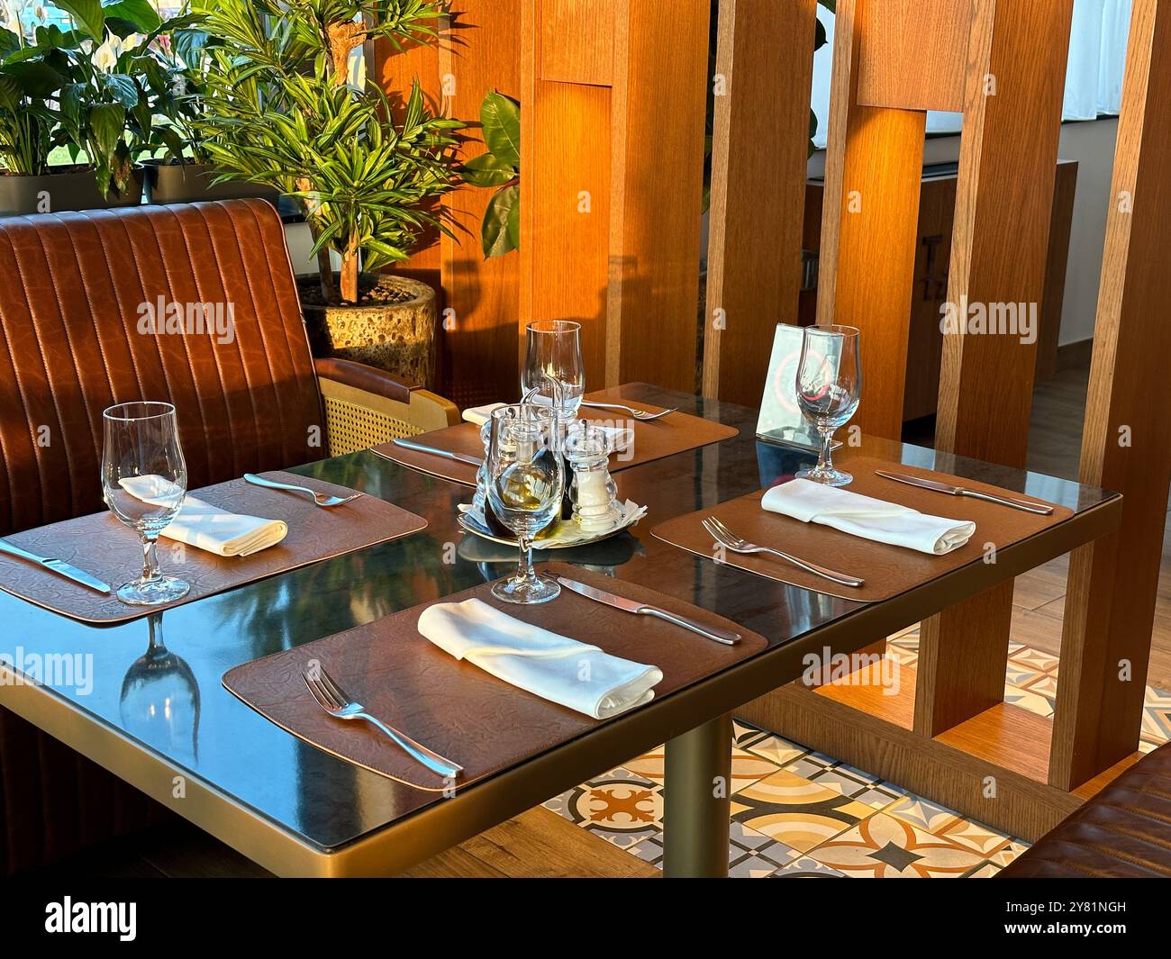Cozy restaurant interior with elegantly set table, ready for guests ...