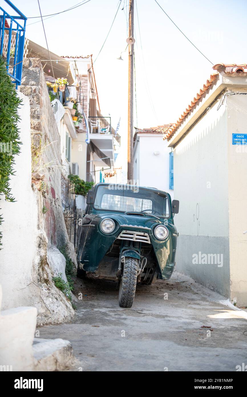 A beaten up old 1960s Mazda T1500 3 wheeler truck being used as a ...