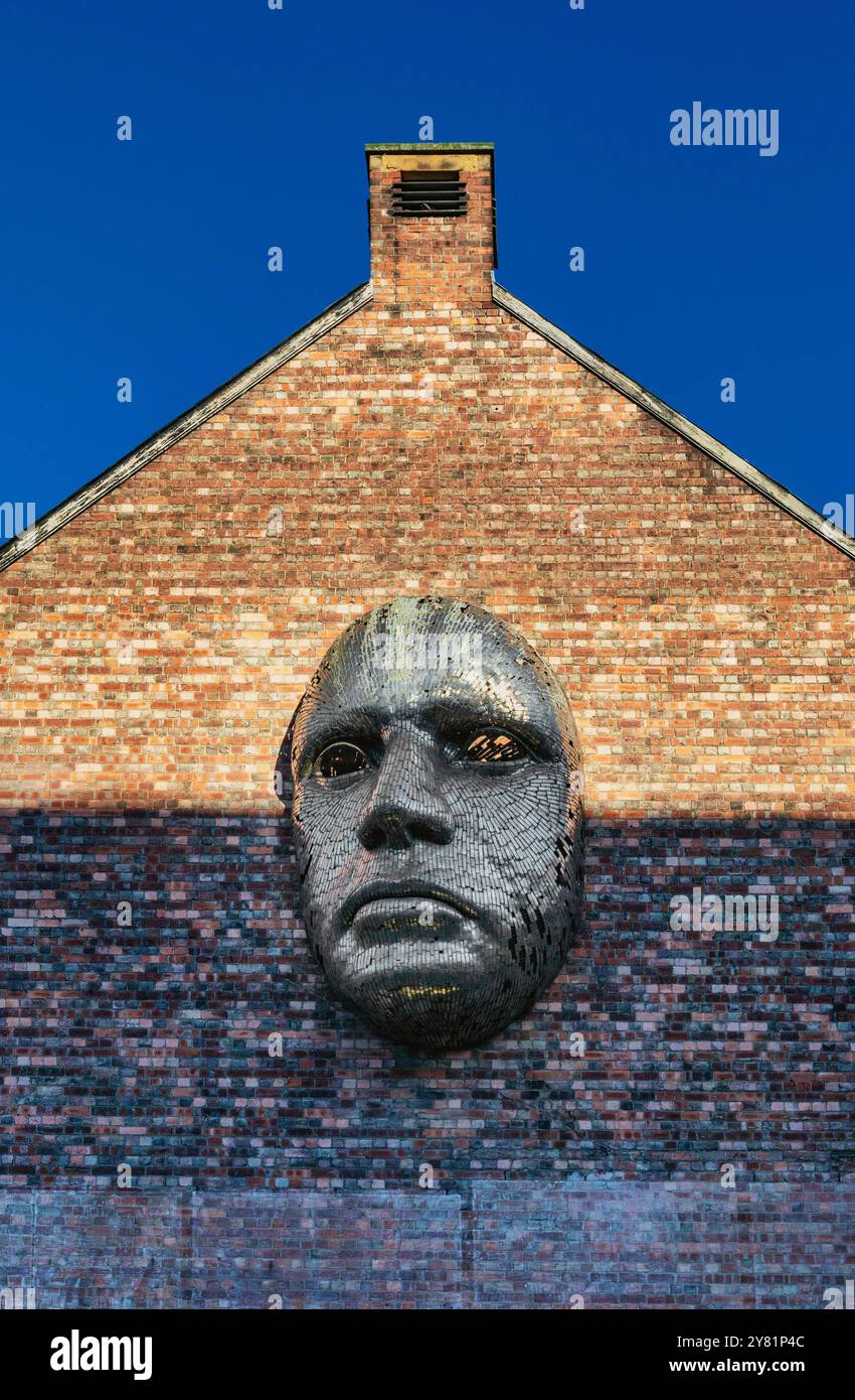 A face sculpture on the outside wall of Lincoln City Drill Hall Stock ...