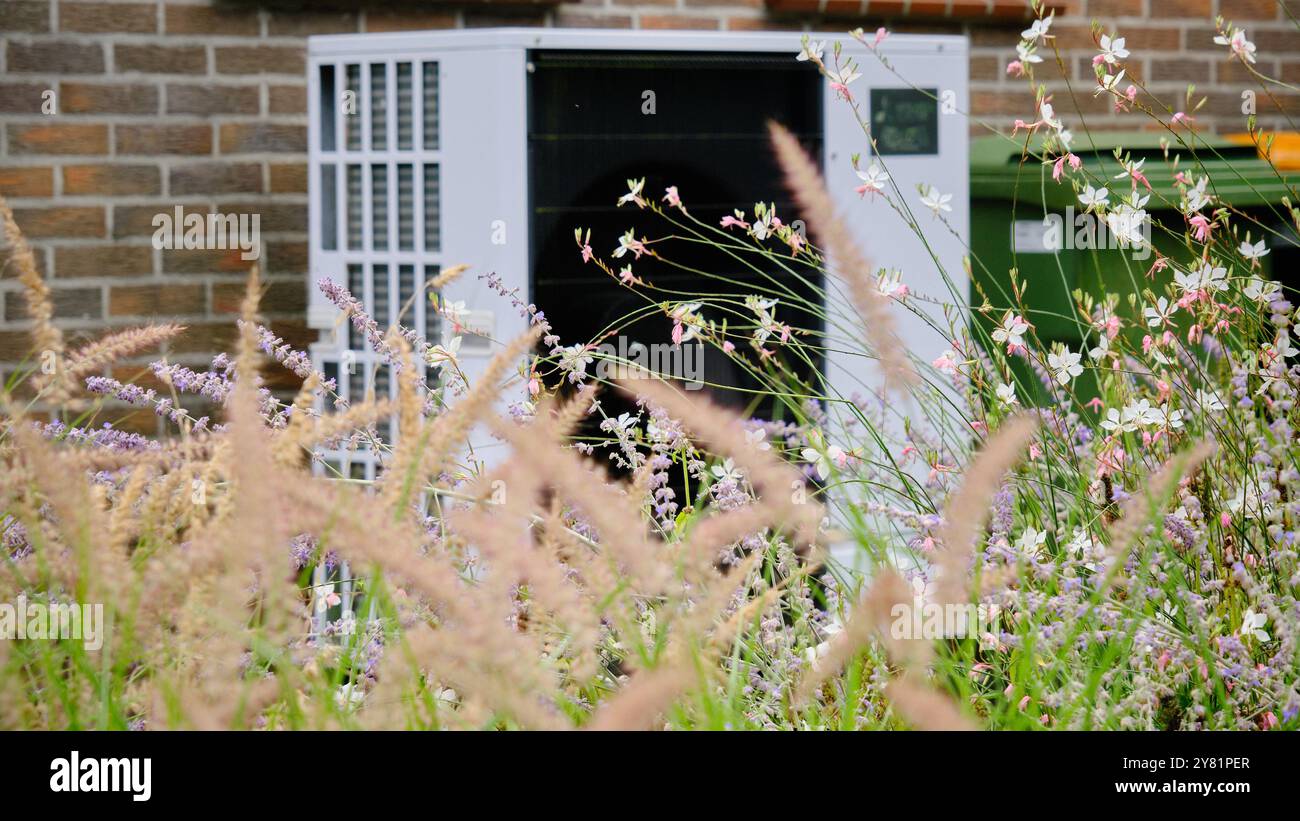 modern air-source heat pump shot over the garden, demonstrating energy ...