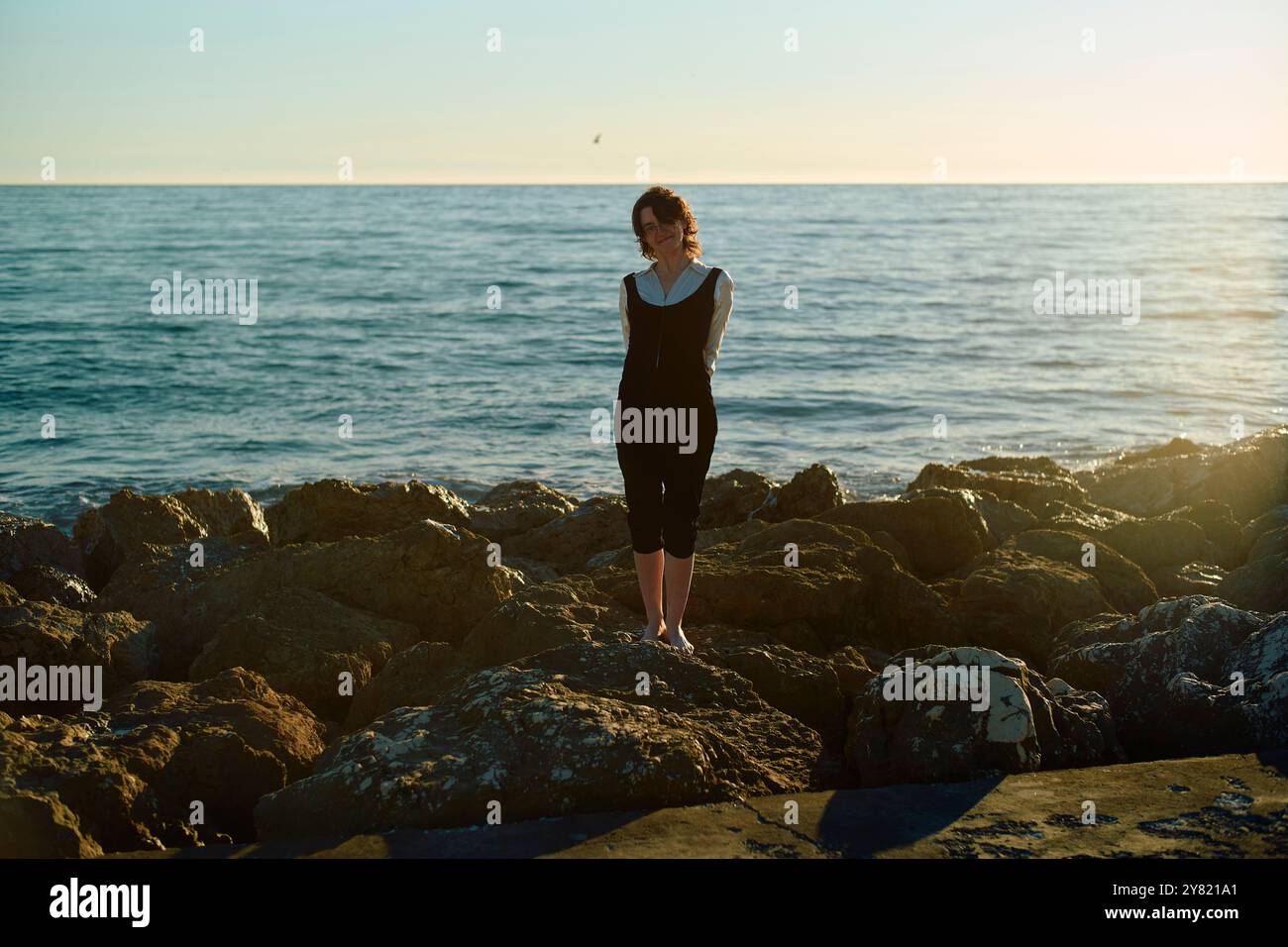 Rocky shore with sunset hi-res stock photography and images - Alamy