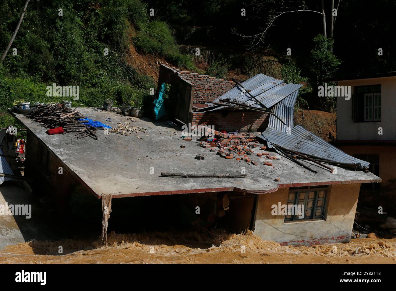 On October 1, 2024, in Kavre, Nepal. Damaged house is pictured after ...