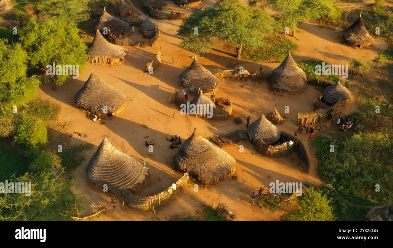 Aerial view of a Larim tribe village with Thatched roofs houses, Boya ...
